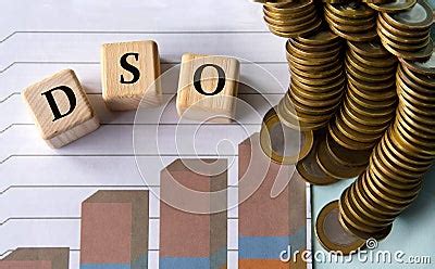 DSO Acronym On A Green Sheet On The Background Of A Graph Pencils And Coins Royalty Free