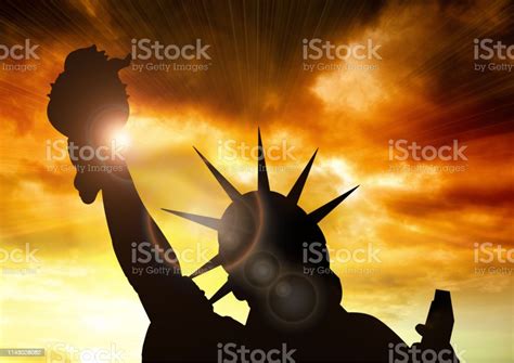 Silhouette Of The Statue Of Liberty Over Gorgeous Sunset Closeup View