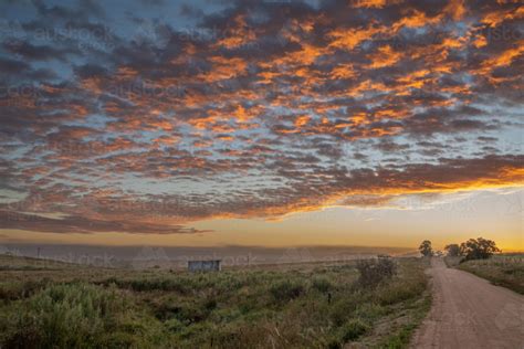Image Of An Early Morning A Colourful Dawn Sky And A Country Road
