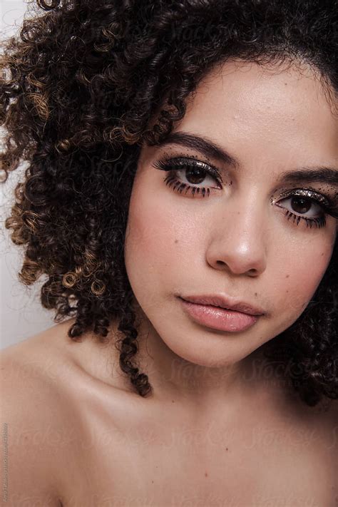 Model With Curly Hair And Sparkly Eyeshadows By Stocksy Contributor Anna Tabakova Stocksy