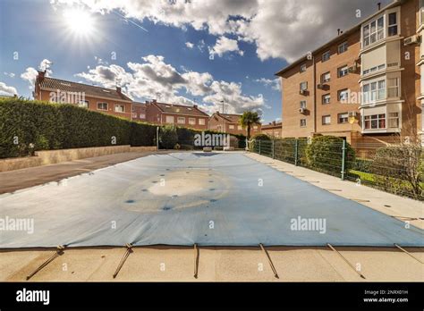 A Summer Pool Covered With Canvas To Spend The Winter In The Common