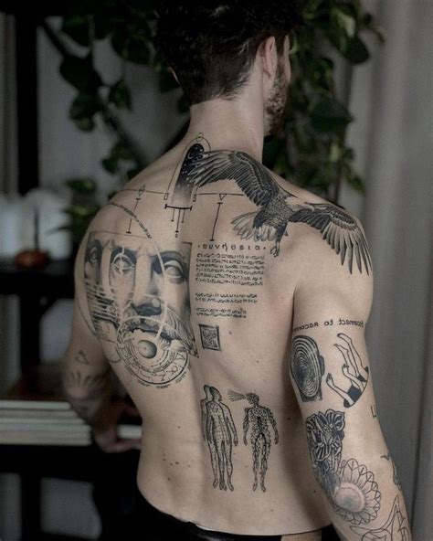 42 Man With Intricate Black Tattoos On Back And Arms Featuring