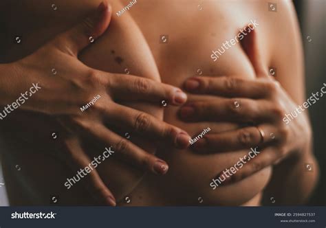 Passionate Naked Woman Touching Breasts Stock Photo