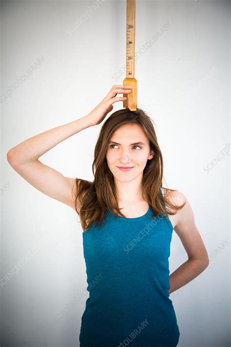 Woman Under Height Gauge Stock Image C034 7342 Science Photo Library