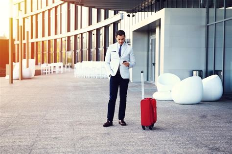 Businessman Walking To Hotel Lobby Full Length Portrait Of Young