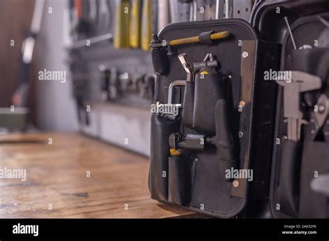 Set Of Tools Screws Pliers And Nuts On A Workshop Background Stock Photo Alamy