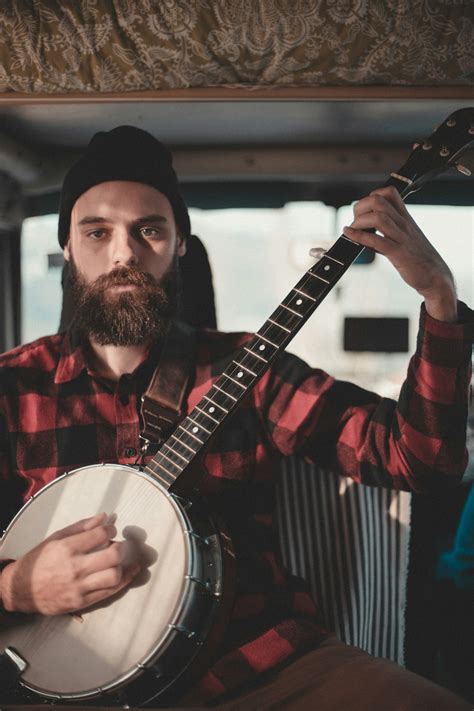 Man Holding String Instrument Photo Free Banjo Image On Unsplash