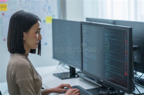 Asian Promt Engineer Develope Coding App With Software Data Sitting In