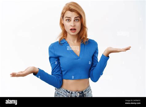 Whats Wrong Annoyed And Confused Woman Shrugs Shoulders Cant
