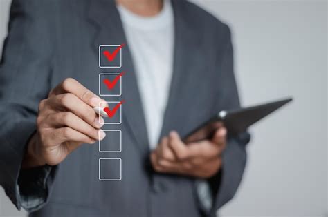 Premium Photo Checklist Concept Businessman Checking Mark On Checkboxes