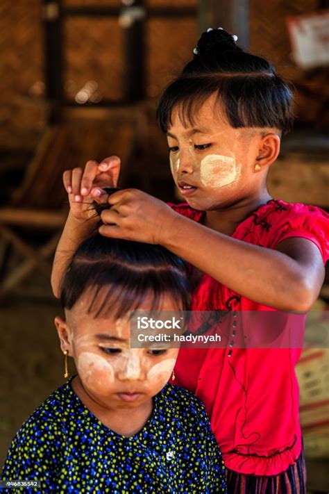 Little Burmese Girl Preparing An Ancient Hairstyle For Her Friend In