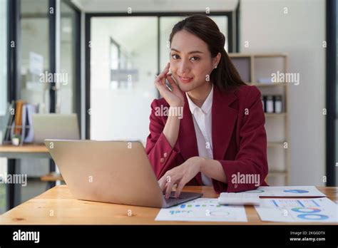 Female Employee Using Laptop At Workplace Businesswoman Preparing Economic Report By Laptop