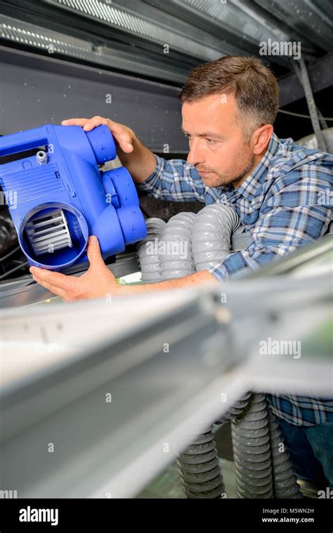 Man Installing A New Air Conditioning Unit Stock Photo Alamy