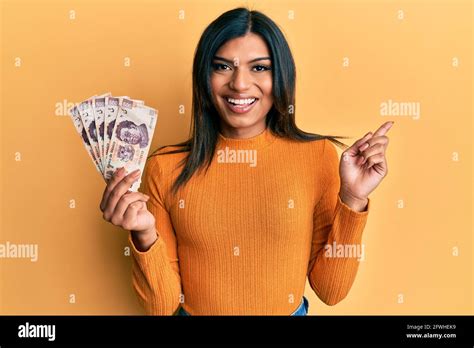 Young Latin Transsexual Transgender Woman Holding 500 Mexican Pesos Banknotes Smiling Happy