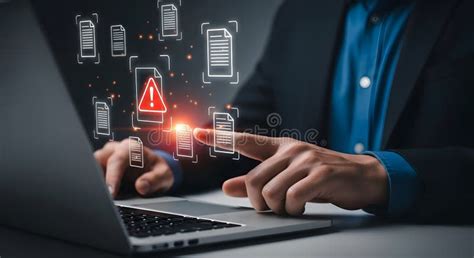 Data Breach Alert On Laptop Computer With Document Icons And Warning Sign For Cybersecurity