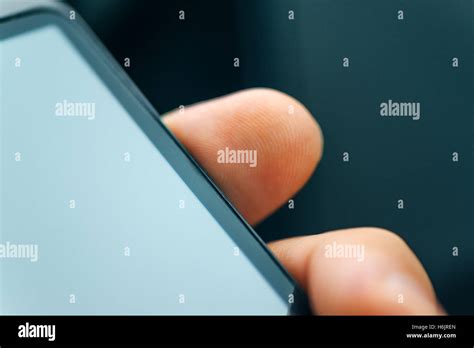 Unlocking Smart Phone With Fingerprint Sensor Scan Close Up With Selective Focus Stock Photo