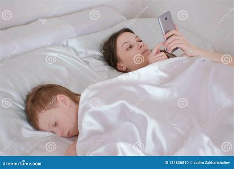 Mom Woke Up And Browsing Internet In Her Mobile Phone Her Son Is Still