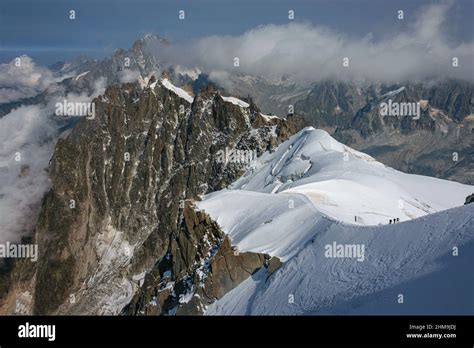 Climbing To The Aiguille Du Midi Viewing Platform Above Chamonix Underneath Mont Blanc Stock