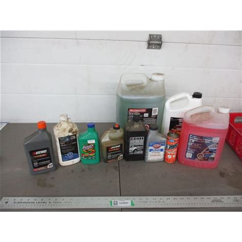 Partial Containers With Oil Antifreeze Washer Fluid