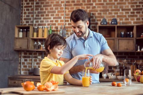 240+ Boy Pouring Juice Stock Photos, Pictures & Royalty-Free Images ...