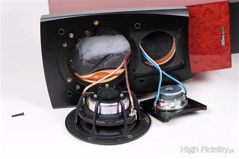 Two Speakers With Wires Connected To Them In Front Of A Box