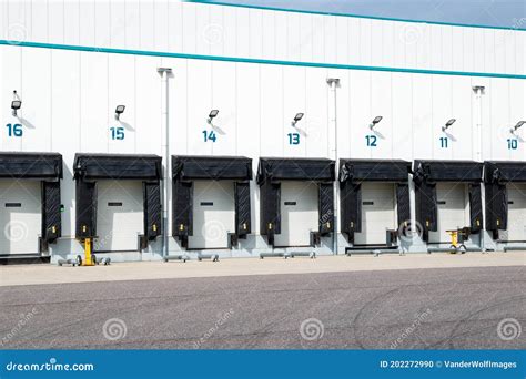 row of loading docks with shutter doors at an industrial warehouse