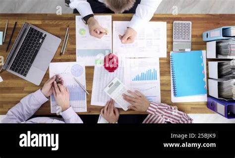 Professionals And Diverse Teams Actively Engaged In Data Analysis And