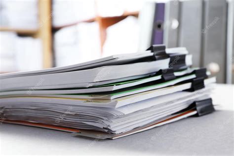 premium photo stack of folders with documents on table in archive