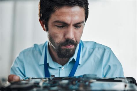 Premium Photo Information Technology Face Laptop Circuit Or Man Repair Motherboard Hardware