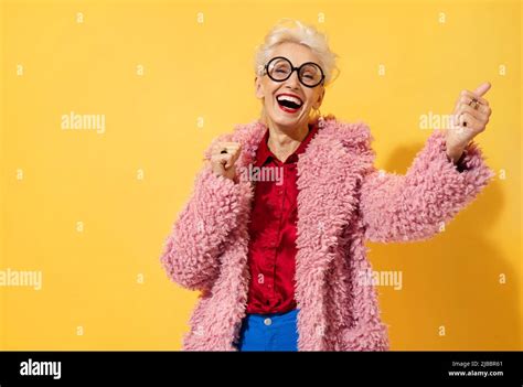 Happy And Playful Mature Woman Dancing Smiling And Having Fun Photo