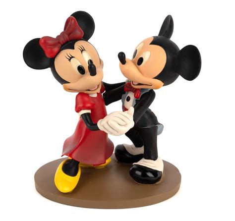 A Figure Of Mickey And Minnie Mouse Dancing