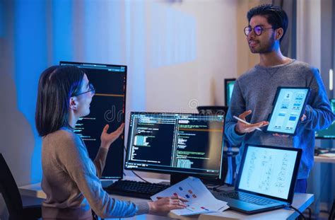 Asian And Indian Developer Devops Team Discussion About Coding Promgram With Software Computer