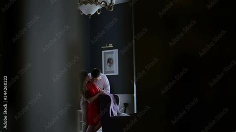 Lovers Man And Woman In The Room Behind The Door Looking Through The Door Gap Peeking At A
