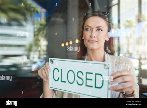 Its Closing Time A Young Entrepreneur Holding A Closed Sign In Her