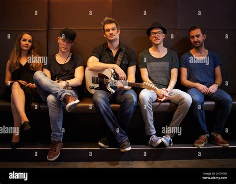 A Band Posing For A Photo Before A Big Show This Concert Was Created