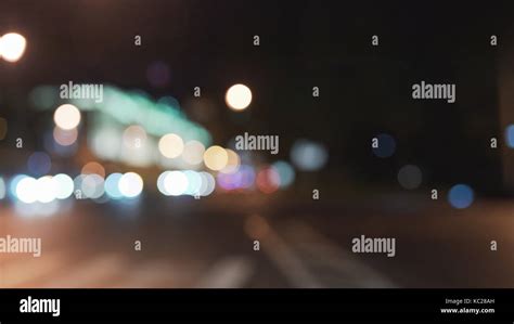 Blurred Background Through Windshield In City At Night Wide Photo