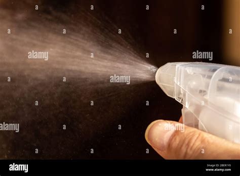 Plastic Squirt Bottle Sprays Liquid Out Of Its Nozzle Stock Photo Alamy