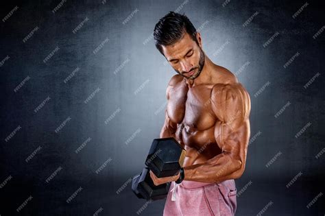 Premium Photo Strong Muscular Men Exercise With Weights Bodybuilder