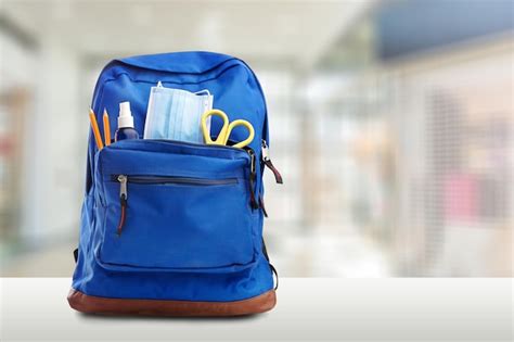 Premium Photo Blue School Backpack On Background