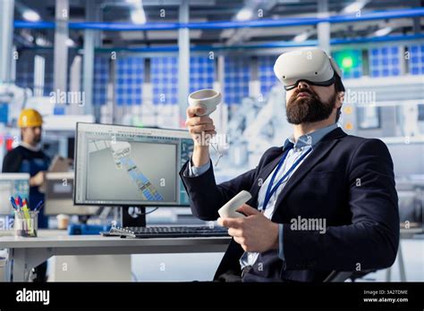 Photovoltaics Factory Worker Using Vr Technology To Analyze And Modify Assembly Line