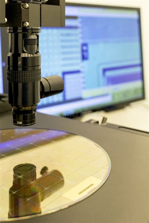 Silicon Wafer On Machine Process Examining In Microscope Stock Image