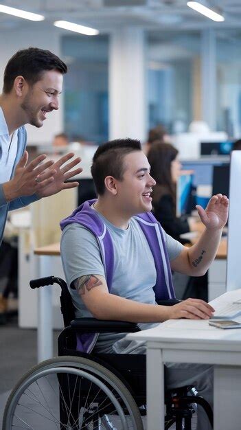 Disability Friendly Office Happy It Programmer With Disability In A Wheelchair Talks With