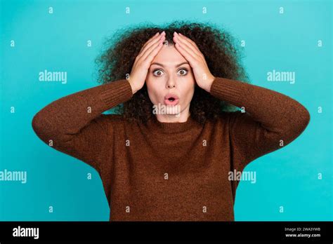 Portrait Of Young Speechless Girl Hands Touching Head Staring Questioned Dont Know Answer At