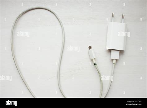 Electric Plug On White Background Broken Power Cord With Charger Broken Usb Cord Smartphone