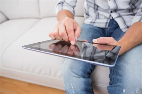 Premium Photo A Man Using A Tablet