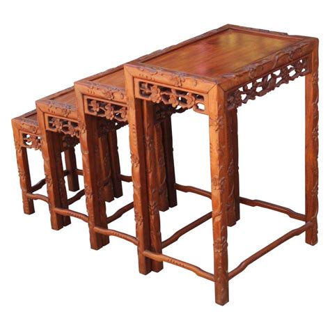 Set Of Four 20th Century Carved Chinese Nesting Tables With Fancy