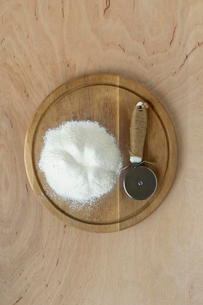 Premium Photo Flour On Cutting Board And Wooden Table Background