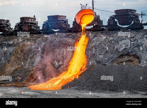 Colorful Stream Of Molten Metal At A Steel Mill Blast Furnace Slag At