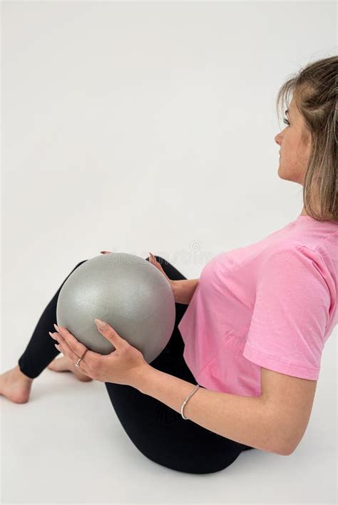 Beautiful Adult Athletic Woman Doing Exercise With Small Fit Ball Isolated On White Stock Image