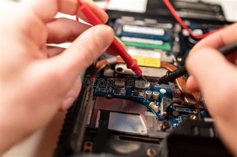 Technical Check Problem For Laptop Computer With Multimeter Close Up
